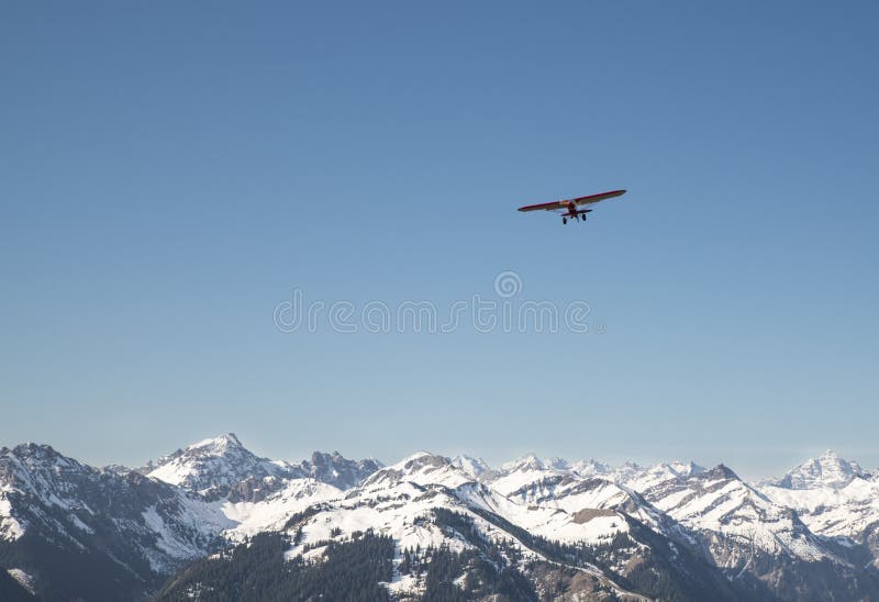 Plane Flying Over The Snow-capped Mountains. Stock Image - Image of ...