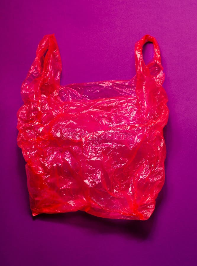 Bright Red Plastic Bag on Light Red Background. Stock Photo - Image of ...