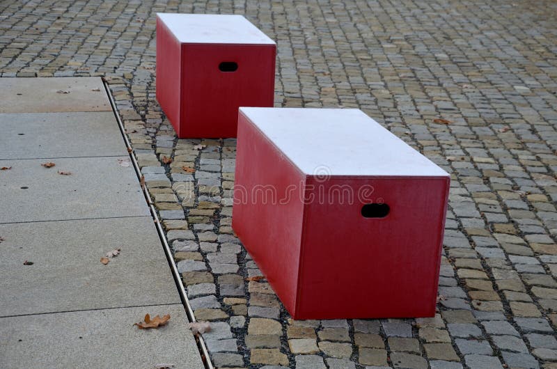 Red Plastic Benches in the Shape of Blocks with Handles. the Square is ...