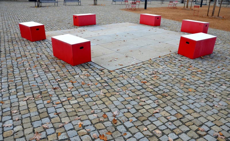 Red Plastic Benches in the Shape of Blocks with Handles. the Square is ...
