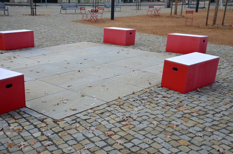 Red Plastic Benches in the Shape of Blocks with Handles. the Square is ...