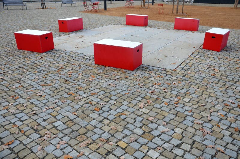 Red Plastic Benches in the Shape of Blocks with Handles. the Square is ...