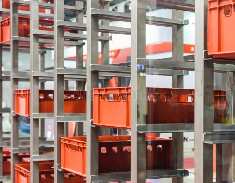 Red Plastic Boxes in the Cells of the Automated Warehouse. Stock Image ...