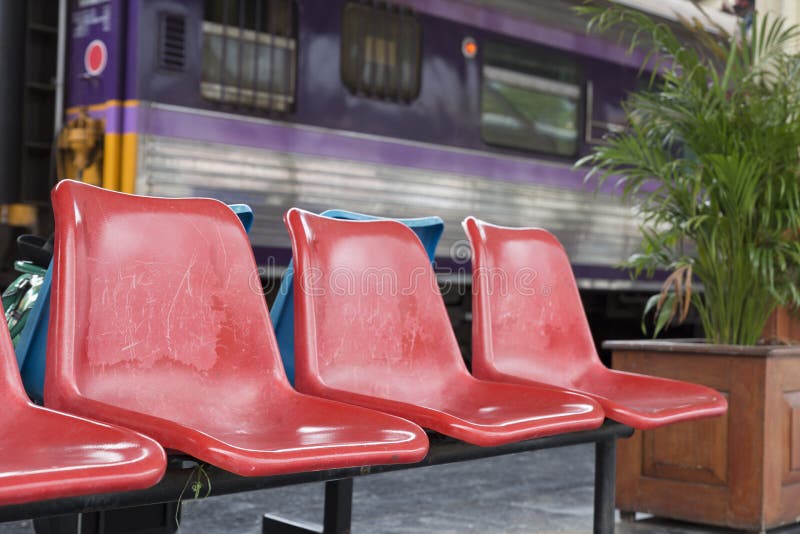 Red Plastic Chair at Train Station Stock Photo - Image of airport ...
