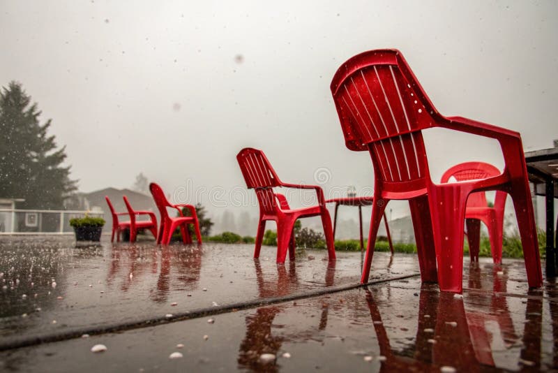 Red Plastic Chairs in the Rain - Generated by Ai Stock Illustration ...