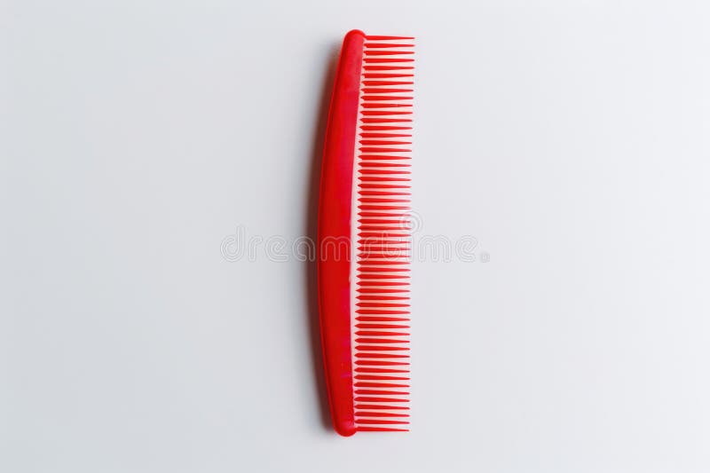 A Red Plastic Comb Isolated on a White Background Stock Image - Image ...