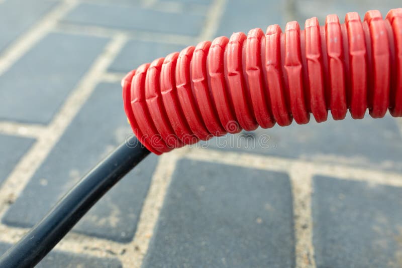 Red Plastic Corrugated Pipe with Wires for Bringing Electricity To the ...