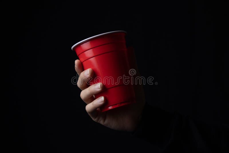 Red Plastic Cup with a Hand in the Dark. Stock Photo - Image of blank ...