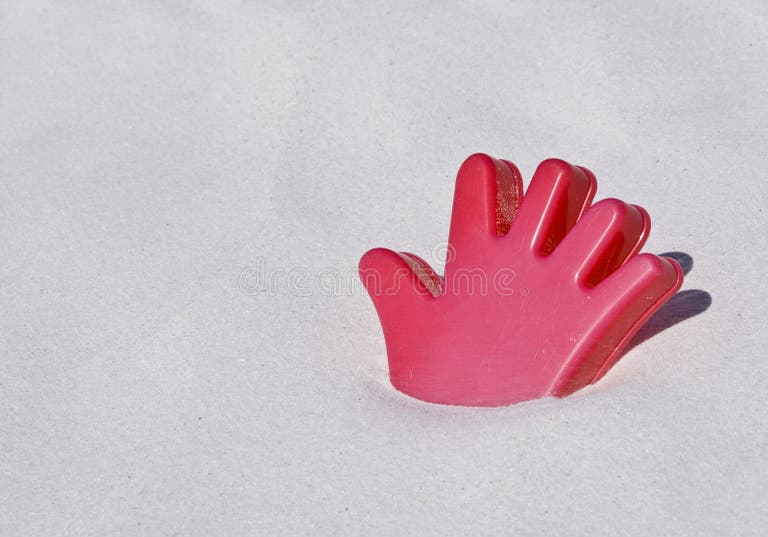 Red Plastic Hand Toy on a White Sand Beach Stock Image - Image of play ...