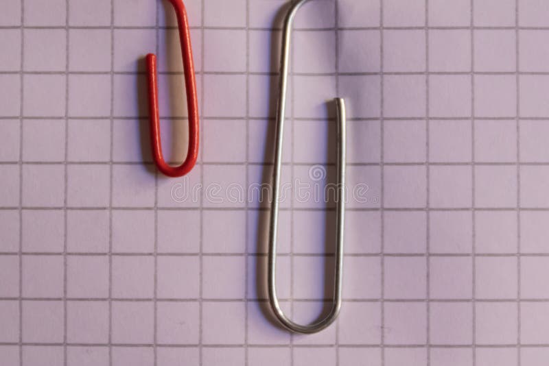 Red Plastic and Metal Paper Clips on Notebook Page Closeup - Image ...