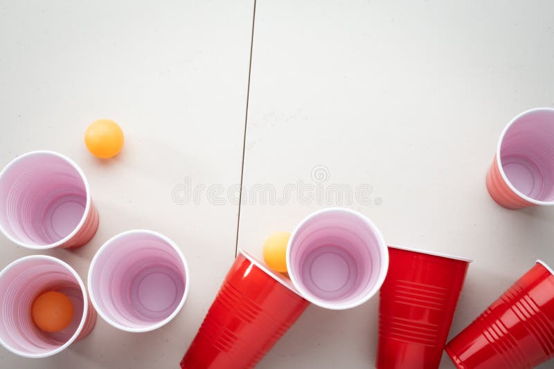 Red Plastic Party Cups and Ping Pong Balls on a White Folding Table ...