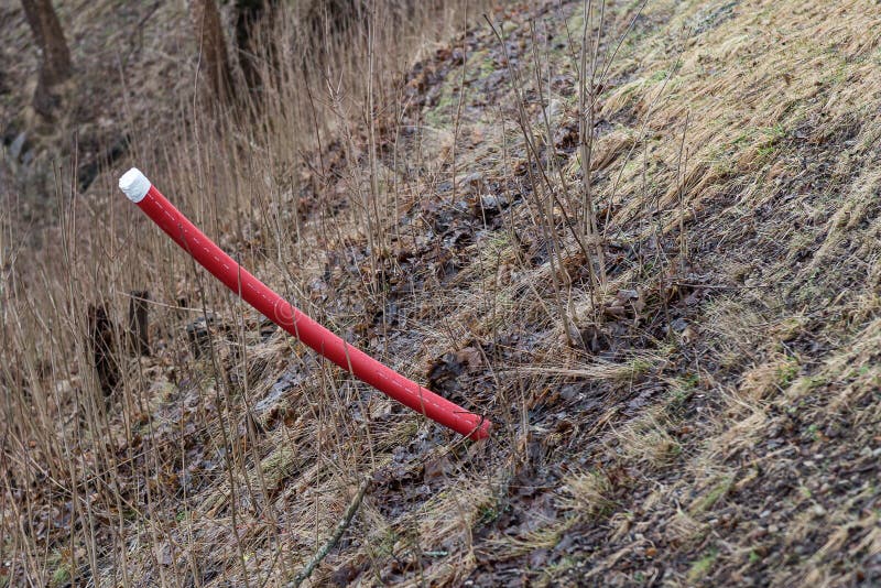 Red Plastic Pipe Protrude from Ground Stock Image - Image of industrial ...