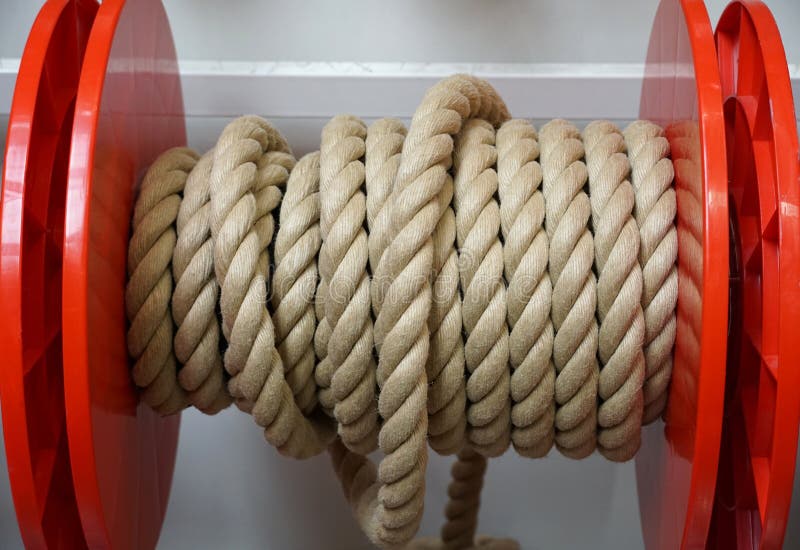 Red Plastic Reel with Thick Cotton Rope Wound on it Stock Photo - Image ...