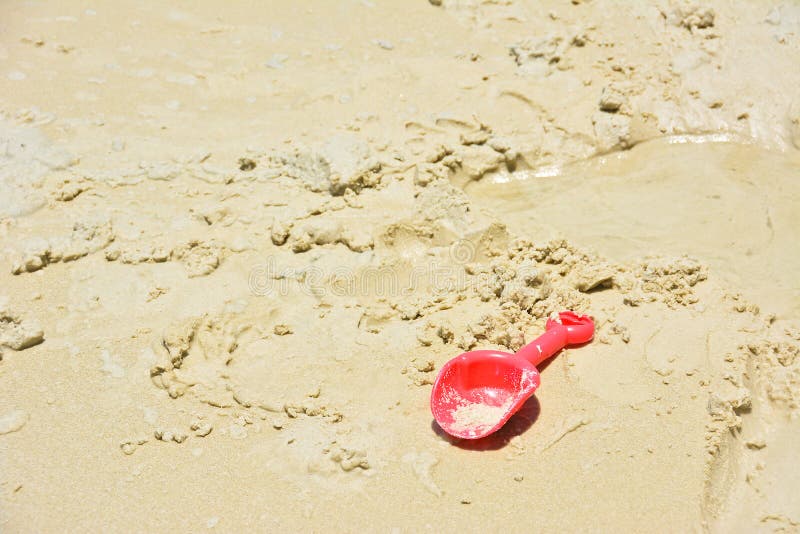 Red plastic shovel toy stock photo. Image of beach, plastic - 30926204