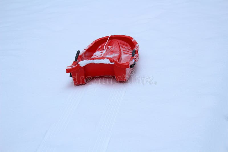 Red Plastic Sled on Ground of Snowfield Stock Image - Image of outside ...