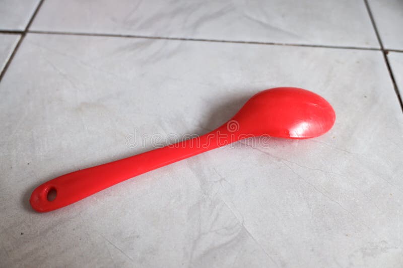 A Red Plastic Spoon is Upside Down Stock Photo - Image of crockery ...