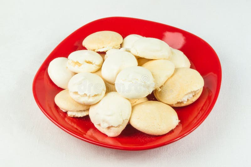 Red plate with meringues stock image. Image of french - 78389349