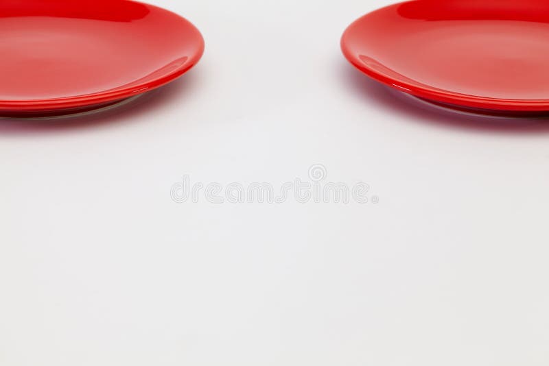 Red Plates on the White Wooden Table.Top View Stock Image - Image of ...