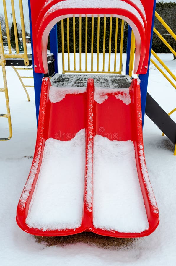 Red Playground Slide in the Snow Stock Photo - Image of winter, snowy ...