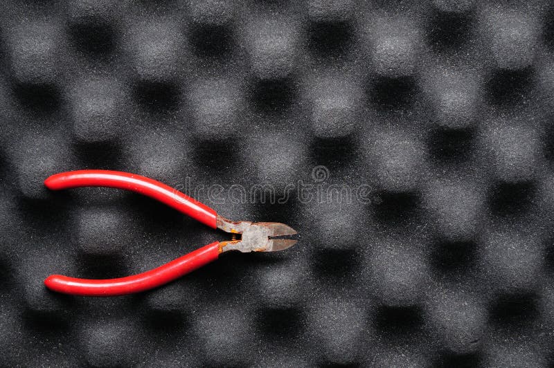 Red pliers on sponge stock photo. Image of holder, plier - 16778000