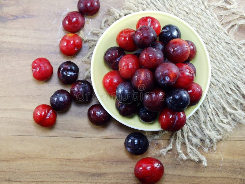 Red Plum on Wooden Background Top View Stock Image - Image of health ...