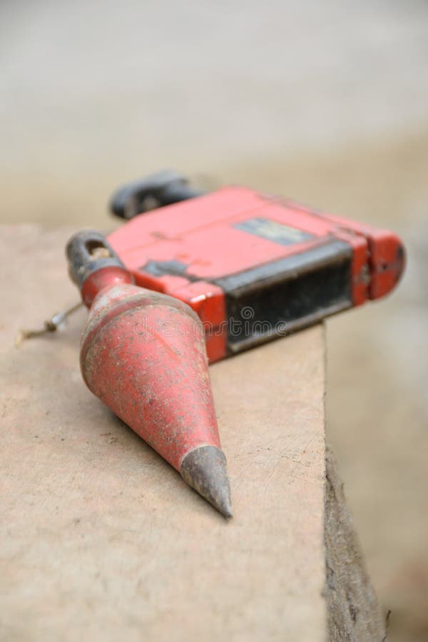 Red plumb on wood plate stock image. Image of balance - 49781573