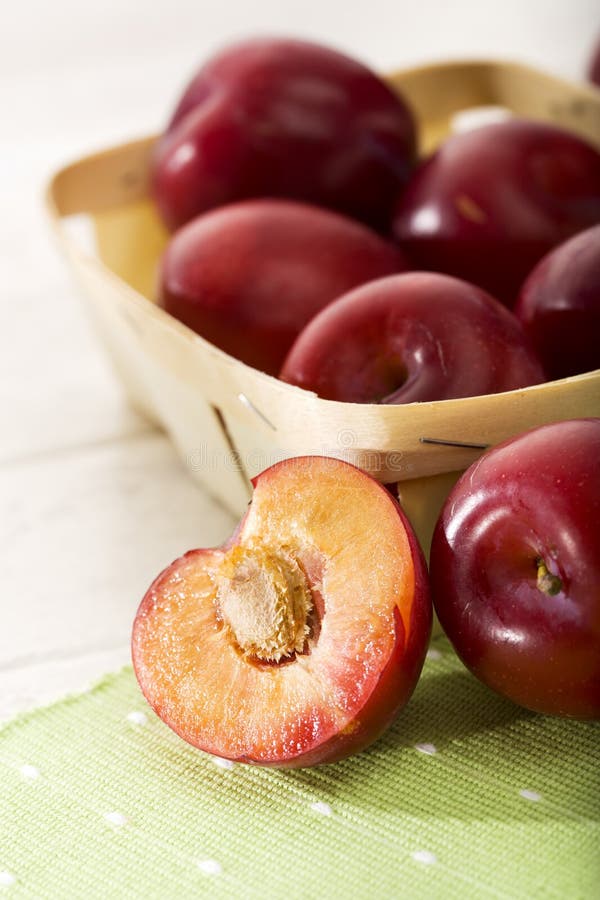 Red plums close-up stock photo. Image of core, fall, sunlight - 4648818