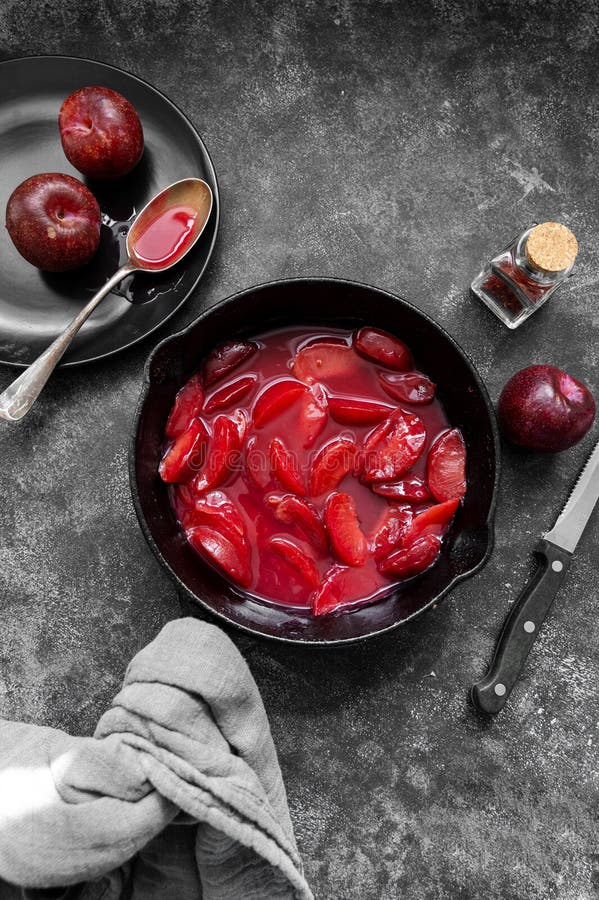 Red Plums Confiture or Jam. Cooking Fresh Fruit Sauce in Black Pan ...
