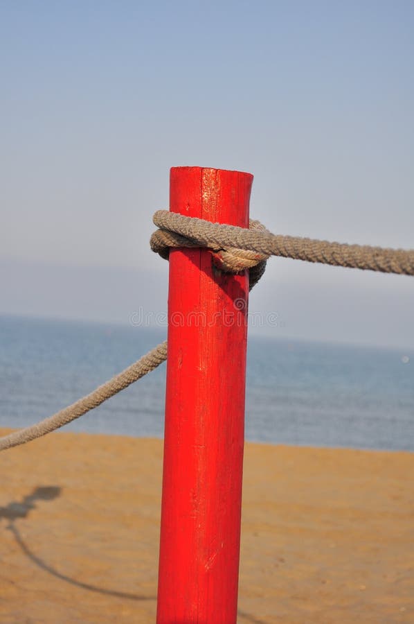 Red pole on the beach stock photo. Image of sailor, beach - 26307700