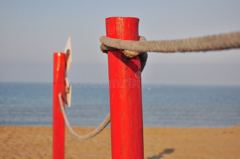 Red pole on the beach stock image. Image of lifeguard - 26307511