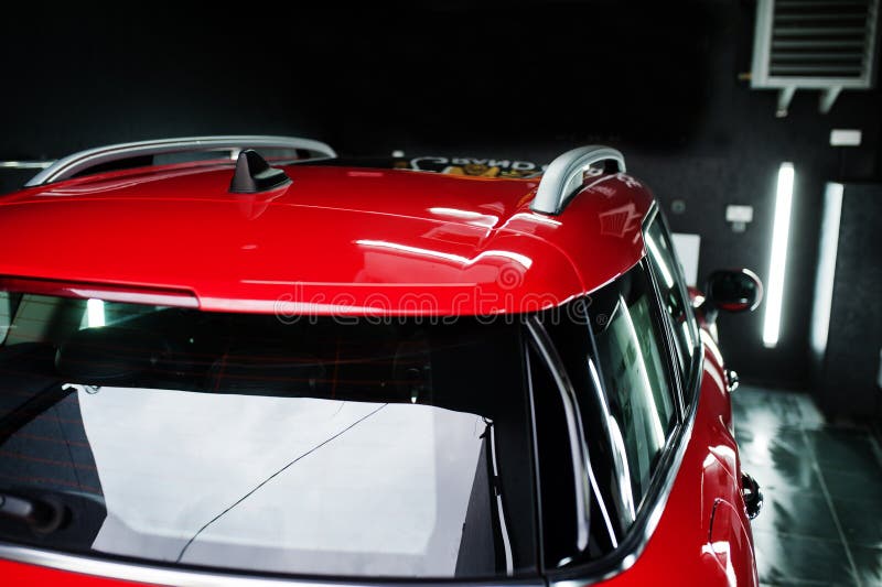 Red Polished Car in Professional Detailing Garage Stock Photo - Image ...