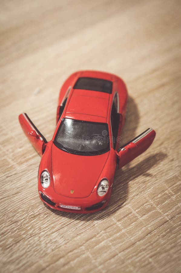 Red Porsche toy car editorial photography. Image of wooden - 83912932