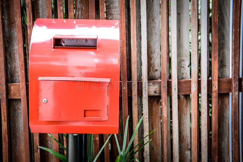 Red Post Box beside Wooden Fence Stock Image - Image of postage, mail ...
