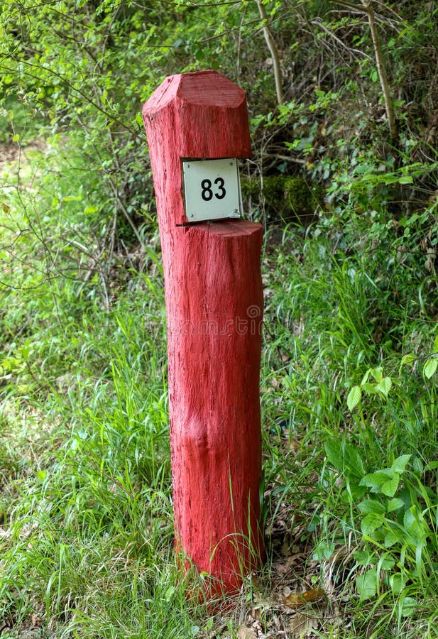 A Red Post with the Number 83 on it Stock Image - Image of number, sign ...