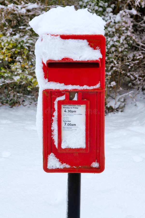 Red postbox in the snow stock image. Image of winter - 16606985