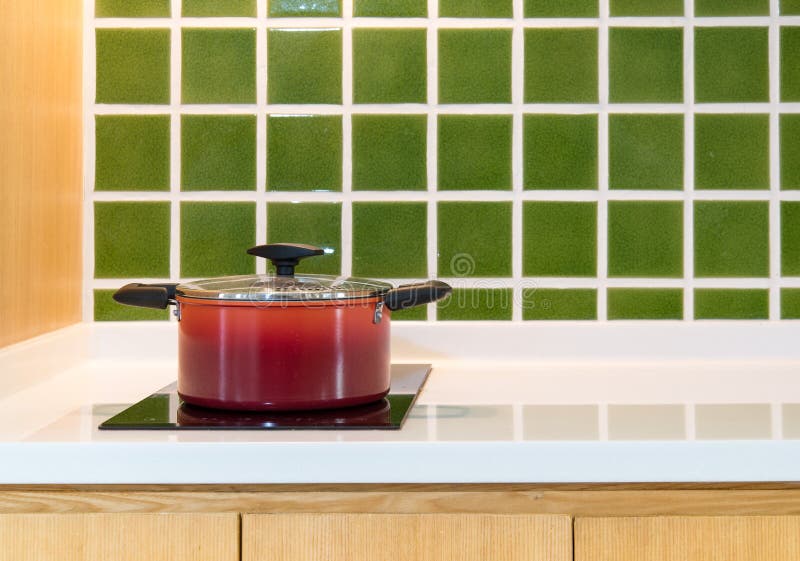 Red Pot in the Kitchen at Home Stock Photo - Image of iron, green: 70166542