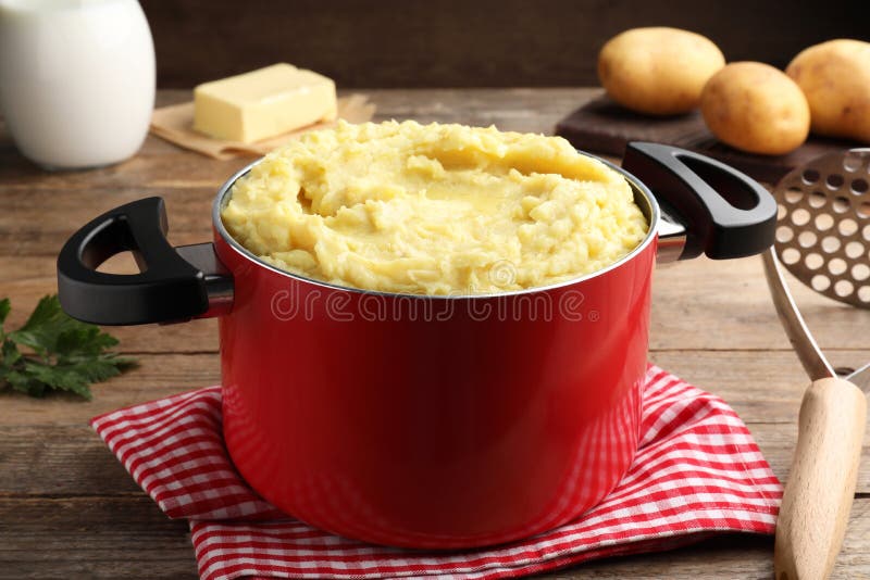 Red Pot with Tasty Mashed Potatoes on Wooden Table Stock Image - Image ...
