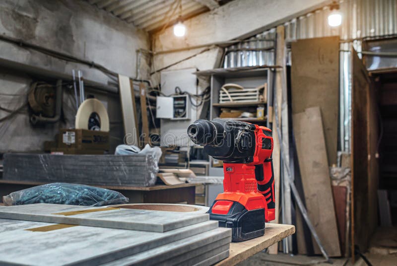 Red Power Drill on Table in Carpentry Workshop Stock Image - Image of ...