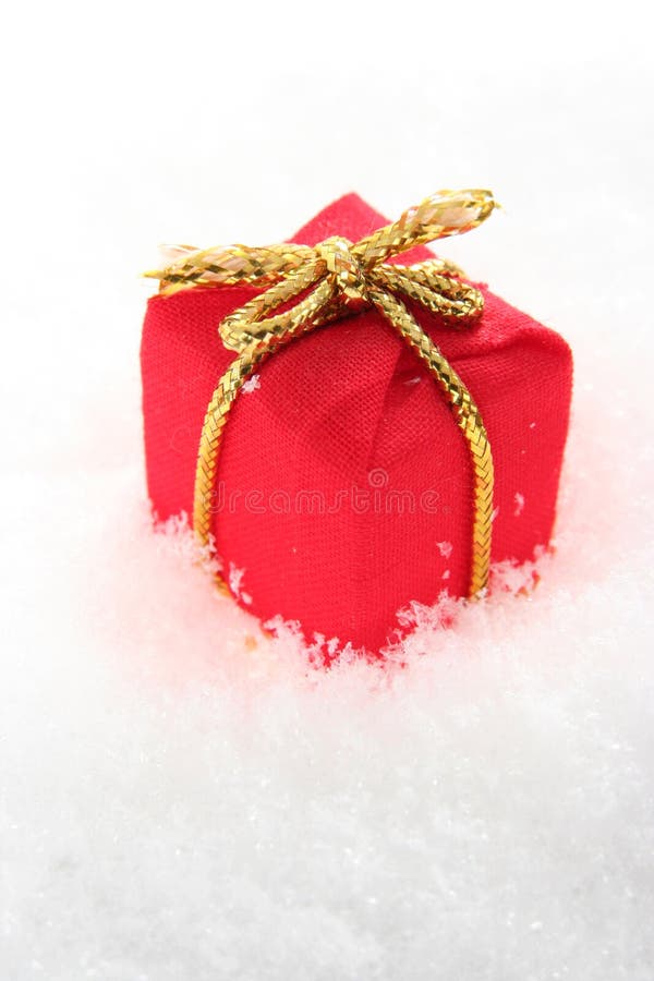 Red present box in snow stock image. Image of season, shadow - 6782831