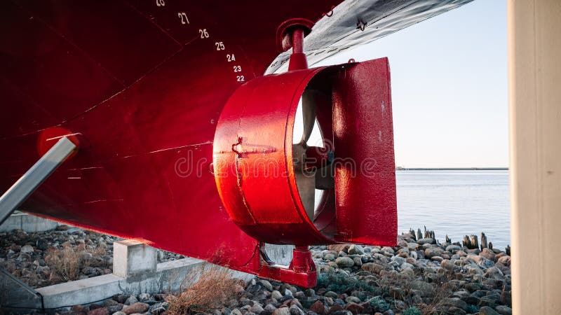 A Red Propeller is on the Side of a Boat Stock Image - Image of harbor ...