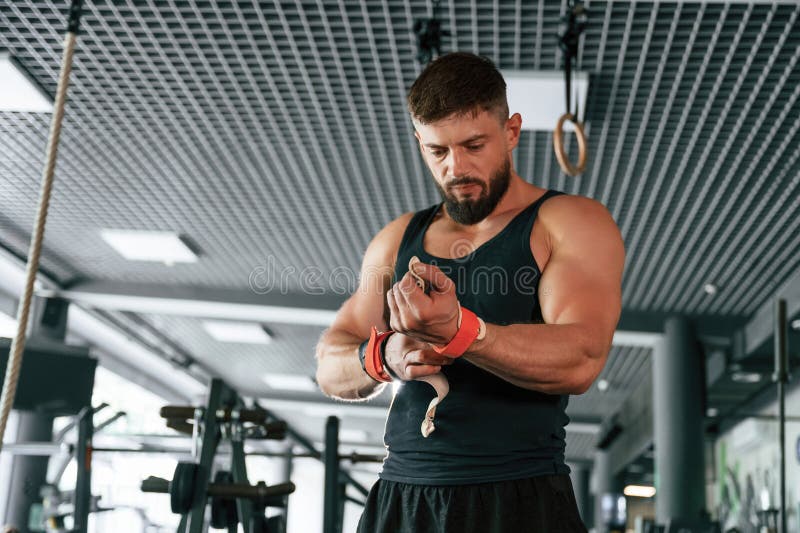 Red Protective Bandages on Hands. Strong Muscular Man is Working Out in ...