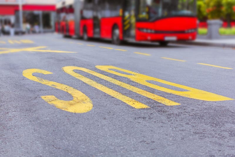 Red Public Transportation Bus on Yellow Bus Stop at Street Stock Photo ...