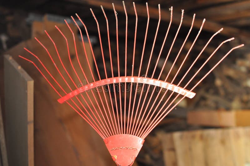 Red rake in a barn stock photo. Image of metal, stick - 90231928