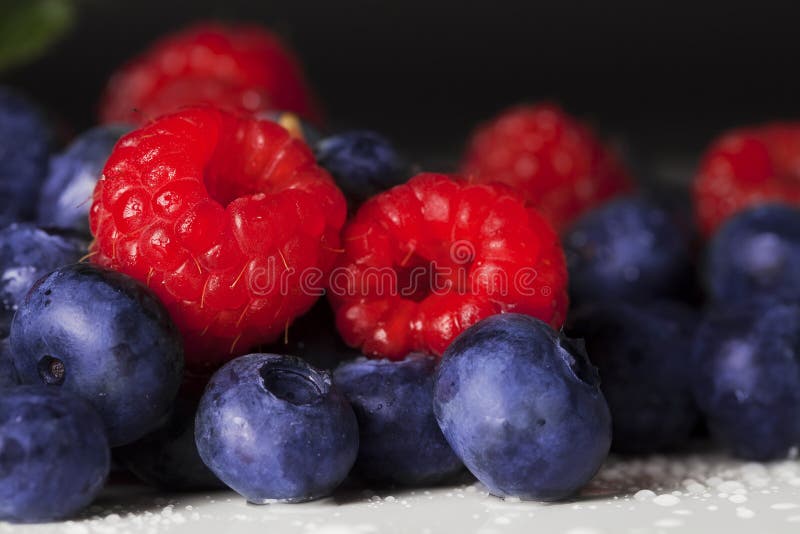 Red Raspberries and Blueberries Stock Image - Image of blueberries ...