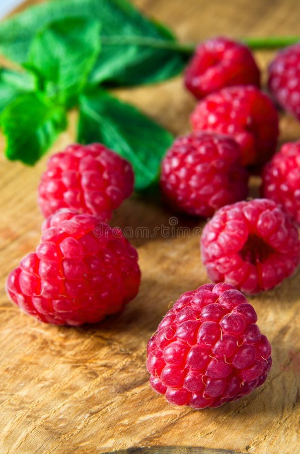 Red Raspberries and a Sprig of Mint Stock Image - Image of wooden ...