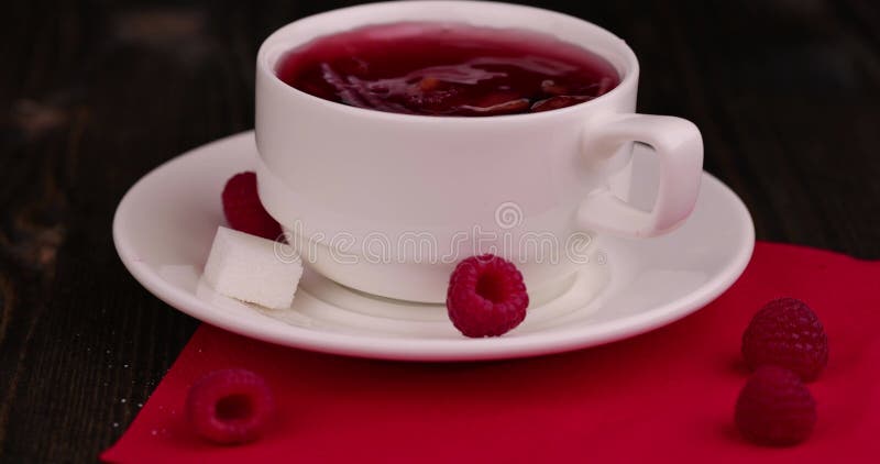 Red Raspberry Tea with Pieces of Fruit and Berries Stock Video - Video ...