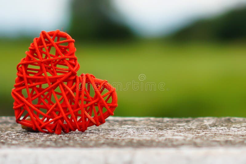 Red Rattan Heart with Natural Blurred Background Stock Photo - Image of ...