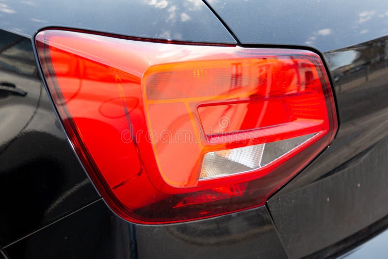 Red Rear Light on a Modern Car with Reflection Stock Image - Image of ...