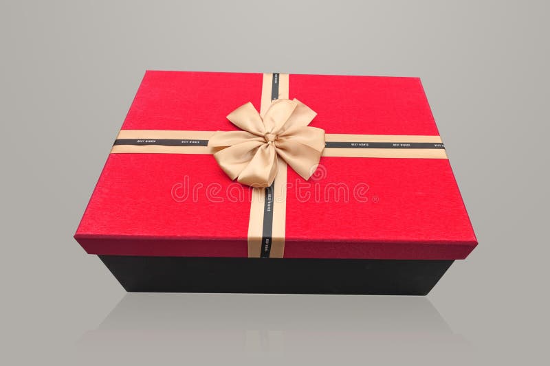 A Red Rectangular Gift Box with Gold Bow Stock Image - Image of ...