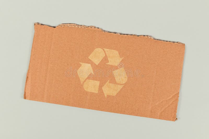 Recycling Arrow Symbol on Piece of Cardboard Stock Photo - Image of ...